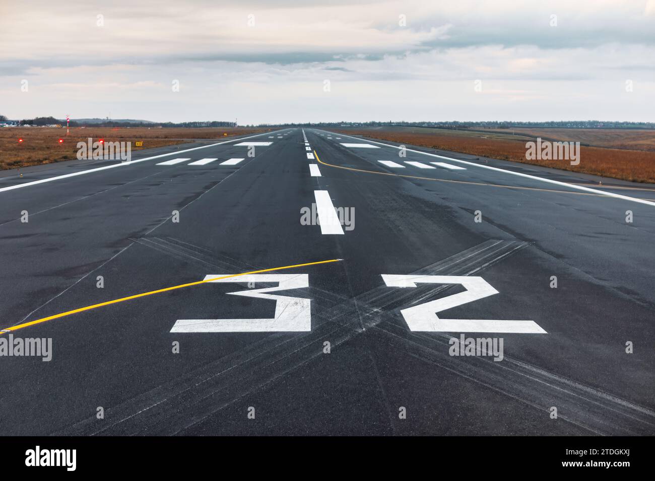 Airport runway with markings on the asphalt. The concept of travel and ...