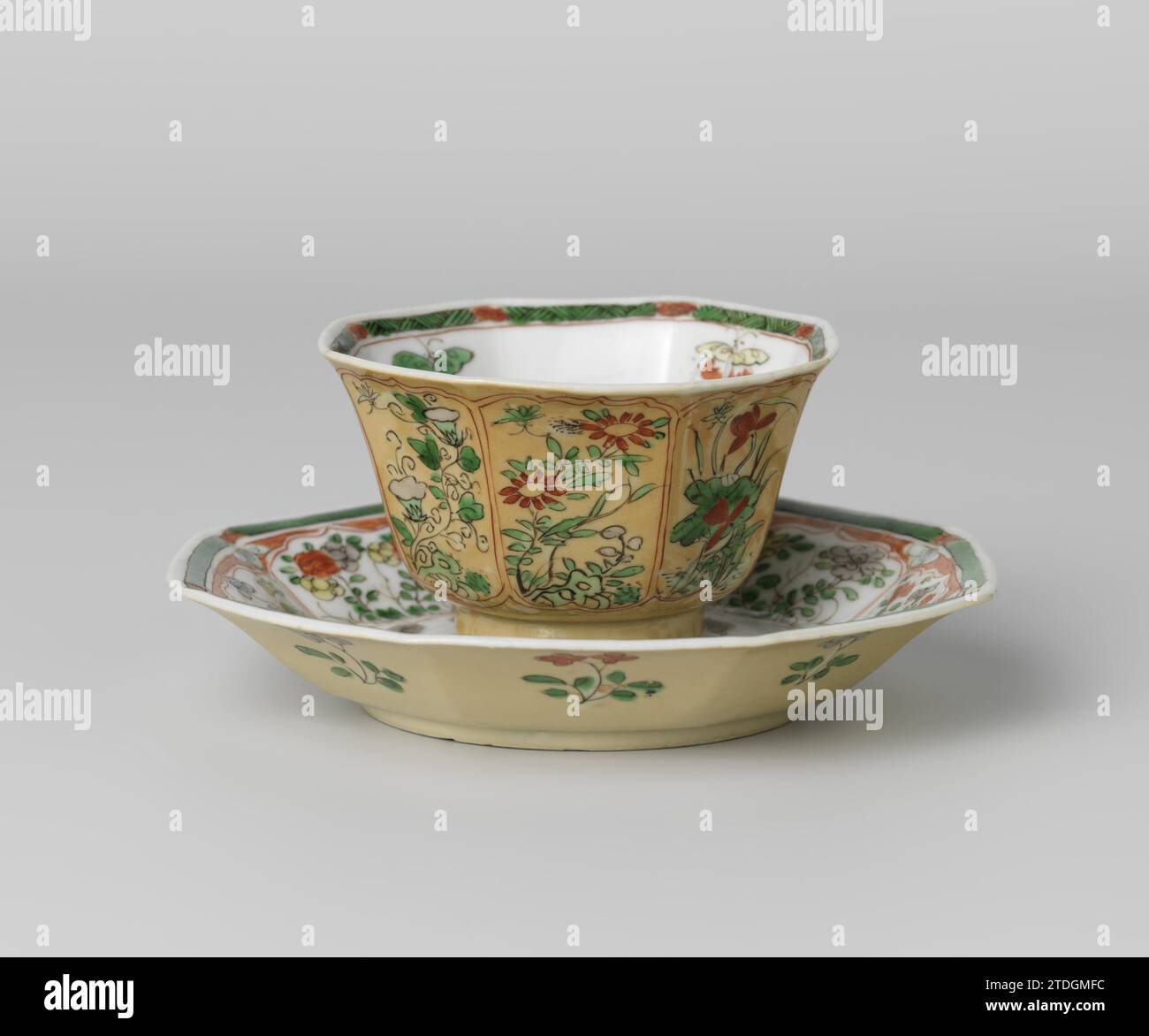 Octagonal cup and saucer with light brown, animals and flower sprays ...