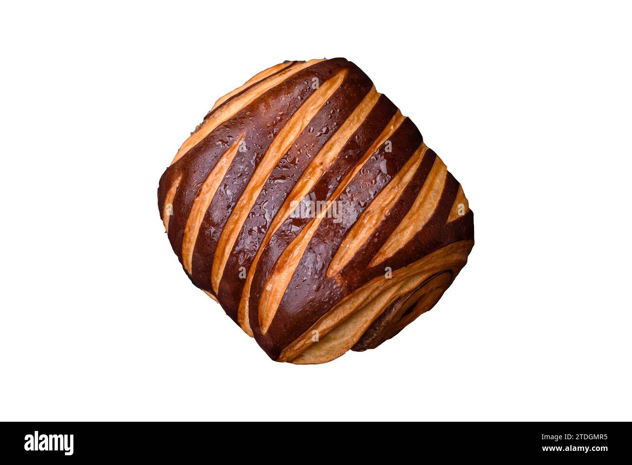 Delicious sweet crispy fresh baked cinnamon bun on dark concrete ...