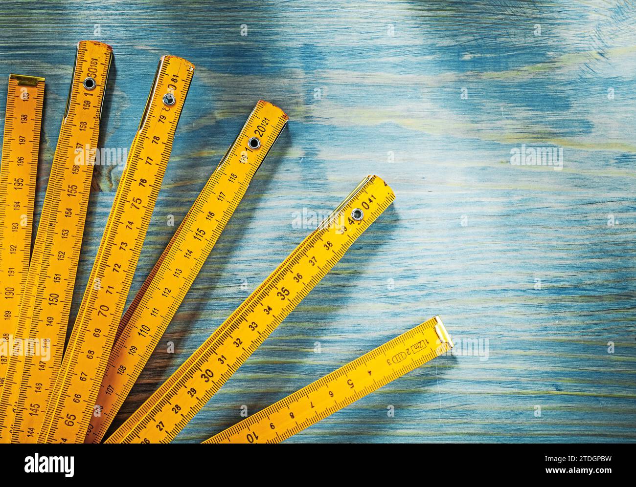 Yellow wooden meter on vintage wood background top view construction ...