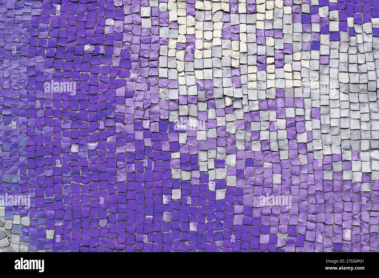 Abstract mosaic ceramic tile background. Chaotic pattern of purple and white ceramic tiles, wall ...