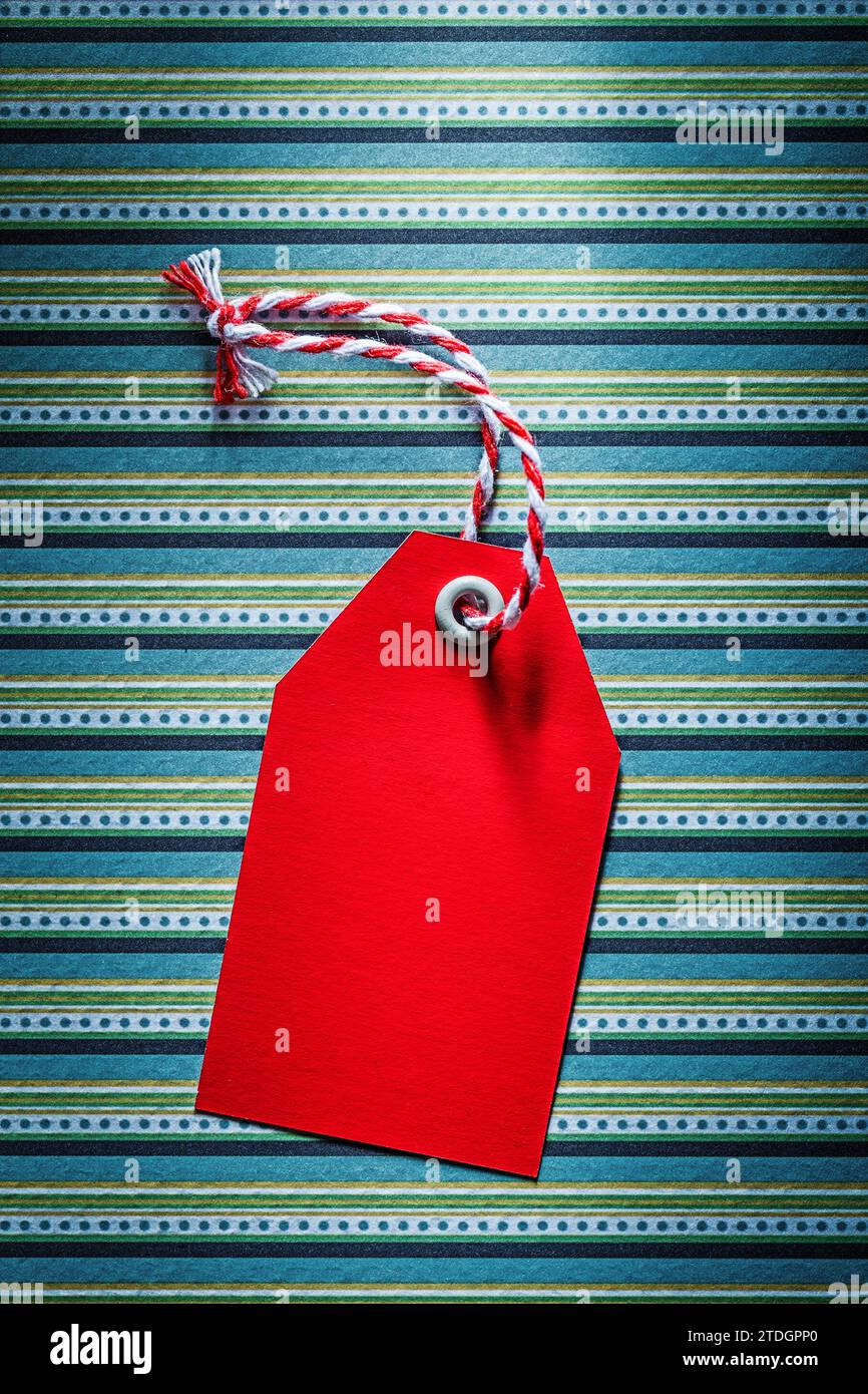 Red price label on striped background Stock Photo - Alamy