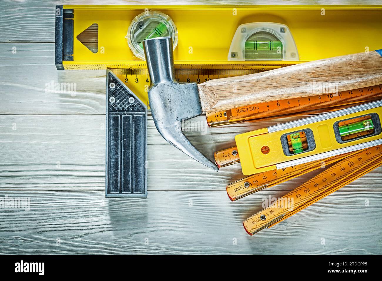 Claw hammer wooden meter construction level try square on white board ...