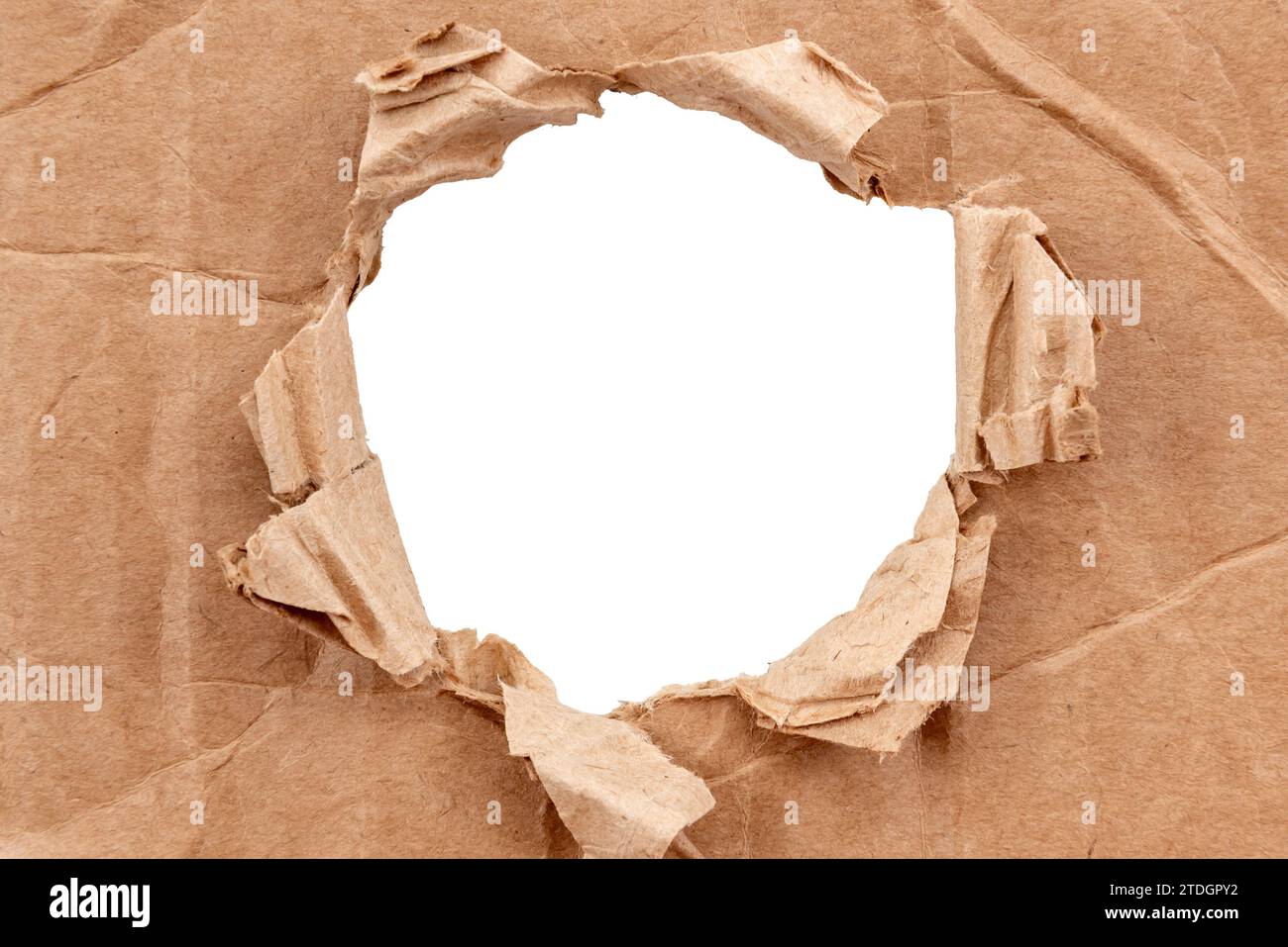 Hole in cardboard. A torn piece of cardboard or paper. Blank space for ...
