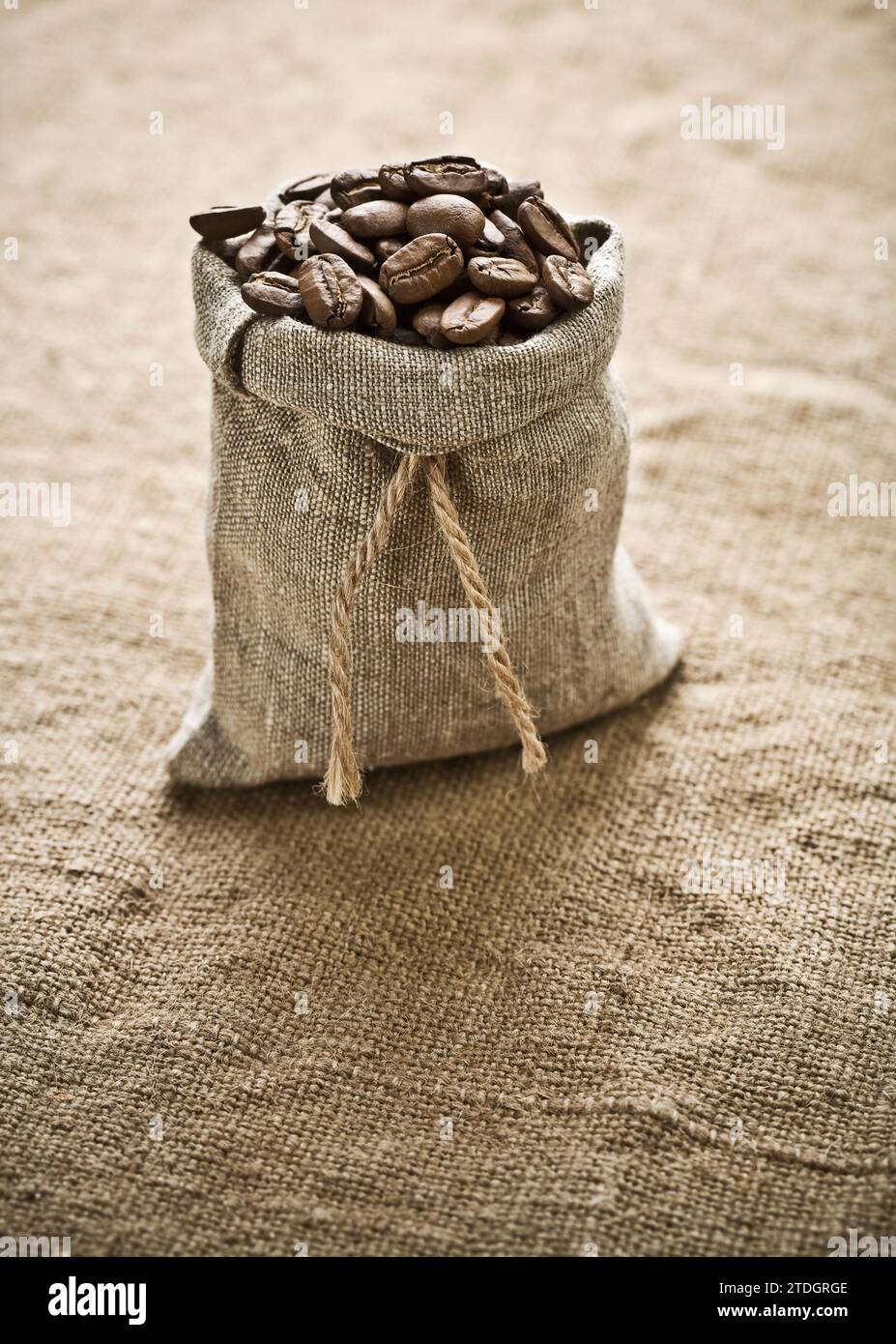 Coffee grains in sacks on sacks Stock Photo - Alamy