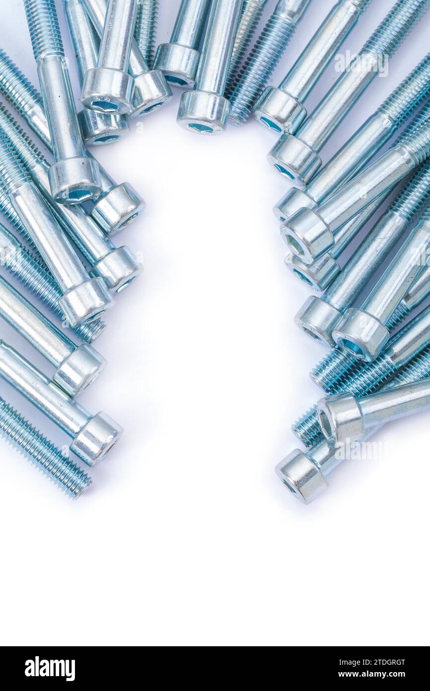 Industrial background long bolts against a white background Stock Photo ...