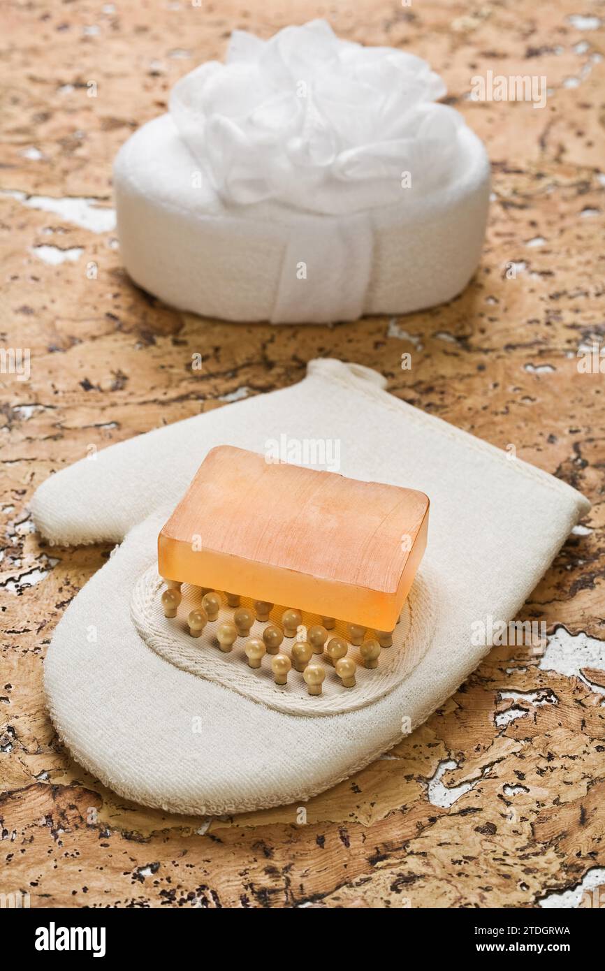 Bath sponge and soap on cork wood Stock Photo - Alamy