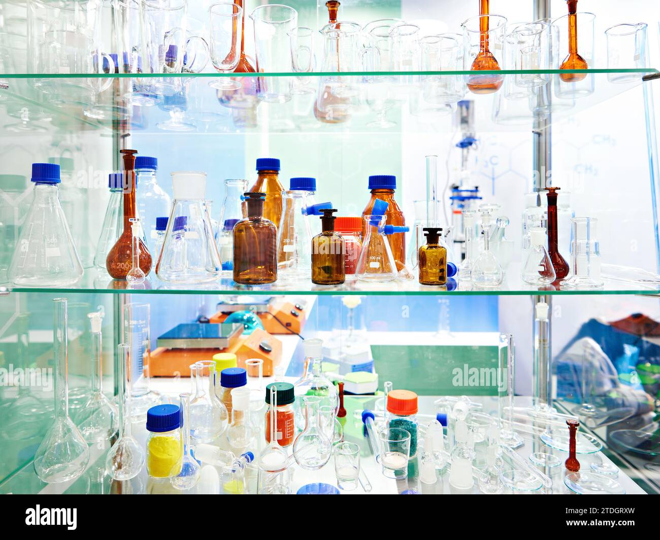 Laboratory glass dishes, bottles, jars and flasks in store Stock Photo ...