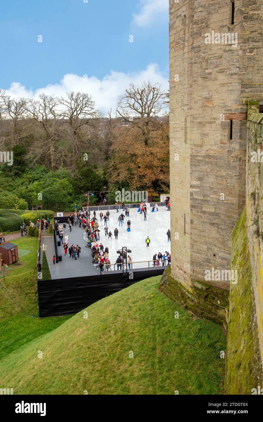 People skating on the temporary mobile artificial ice rink as part of ...