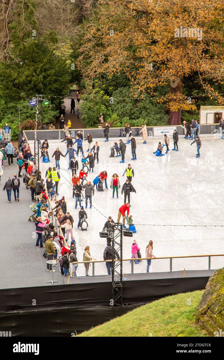 People skating on the temporary mobile artificial ice rink as part of ...