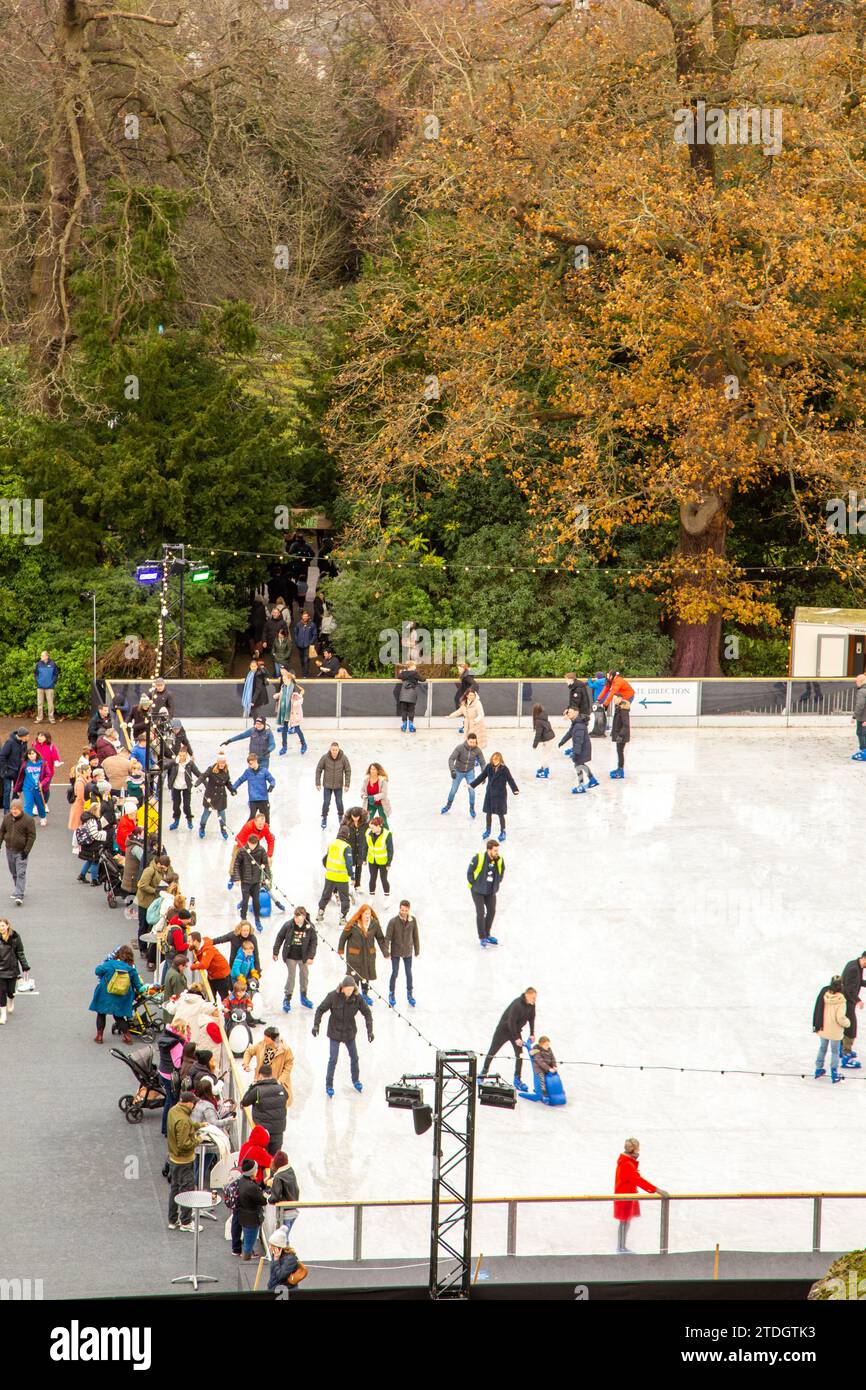 People skating on the temporary mobile artificial ice rink as part of ...