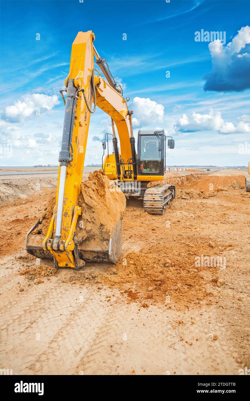 Excavator on the construction site Stock Photo - Alamy