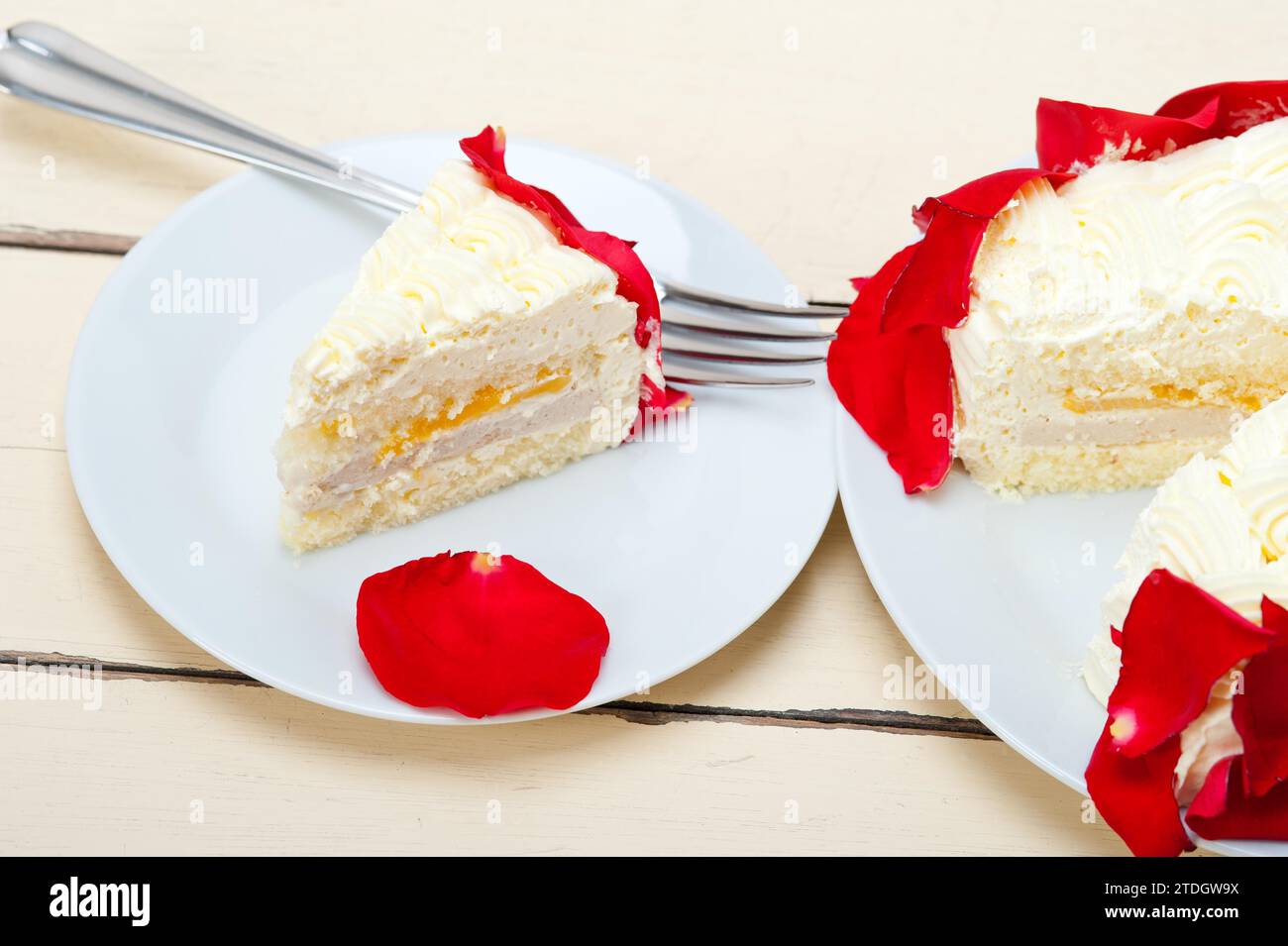Whipped cream mango cake with red rose petals, food photography Stock ...