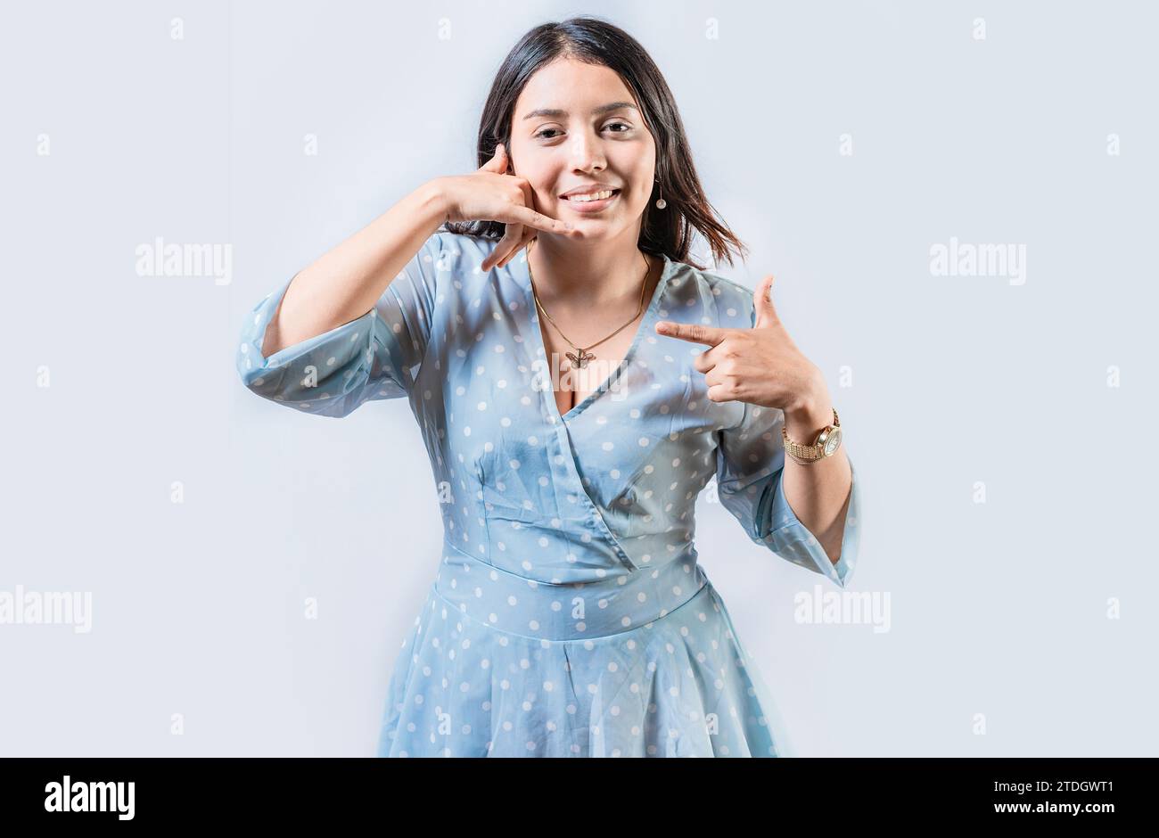 Young woman gesturing CALL ME in sign language isolated. Manual ...