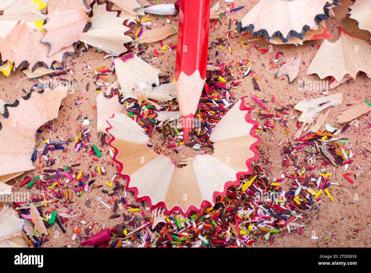 Red Color Pencil over some pencil shavings Stock Photo - Alamy