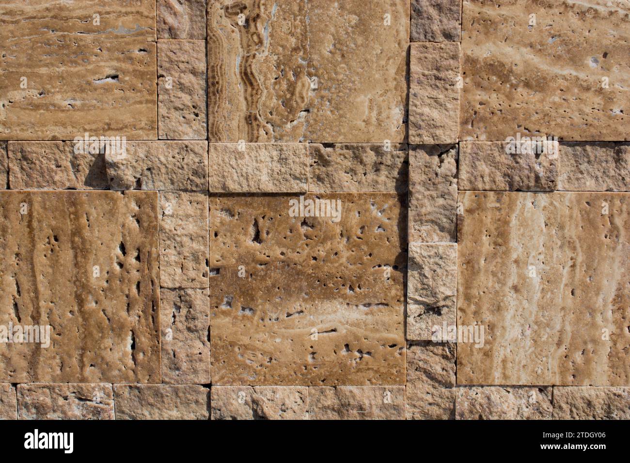Decorative cubic stone wall as background texture Stock Photo - Alamy