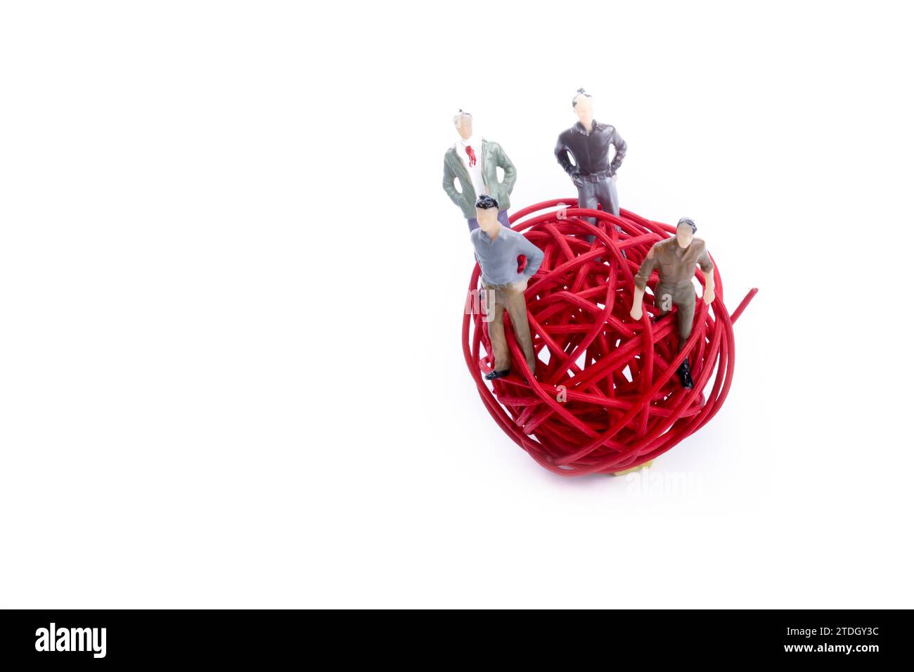 Men standing in spool of thread on a white background Stock Photo - Alamy