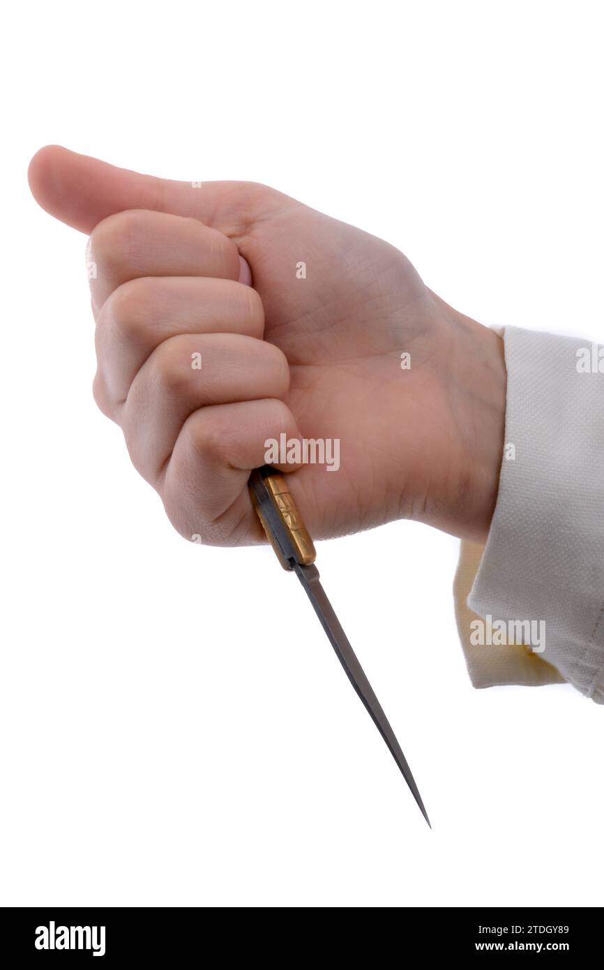 Hand holding a knife in hand on a white background Stock Photo - Alamy