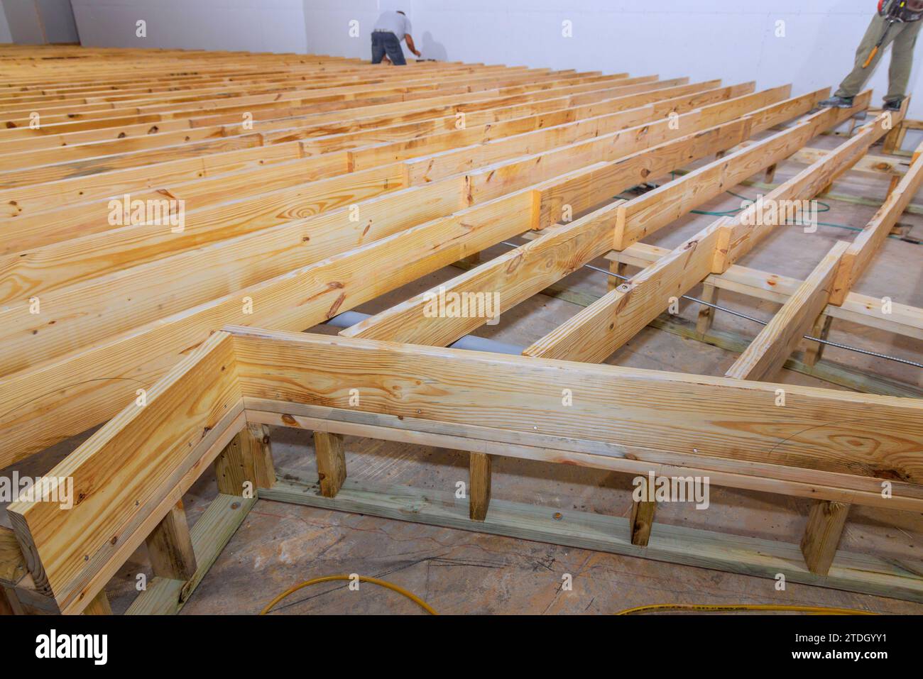 Installing stage indoors using wooden frame beams mounted on wooden ...