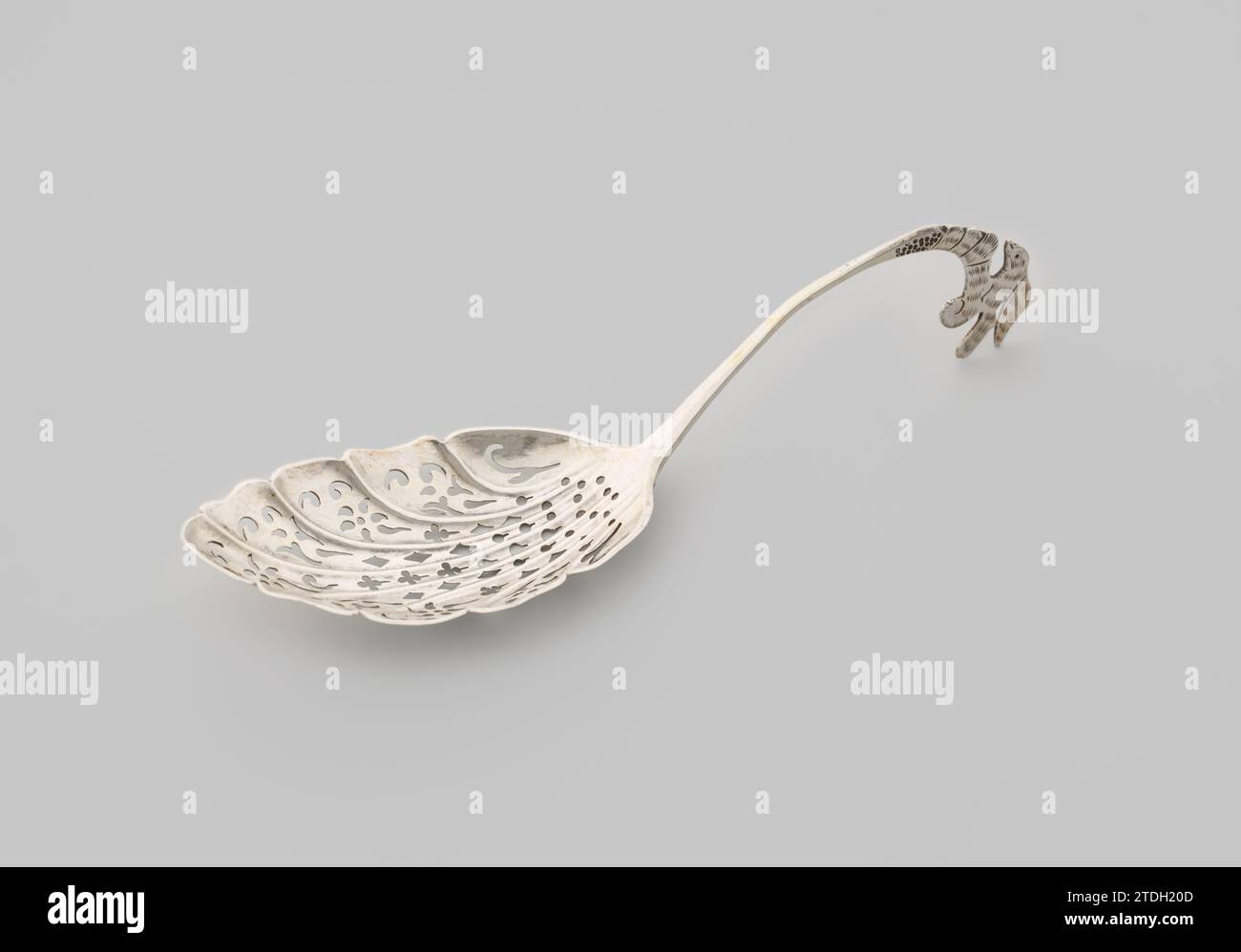 Sprayle with leaf -shaped container and curved stem ending in bird ...