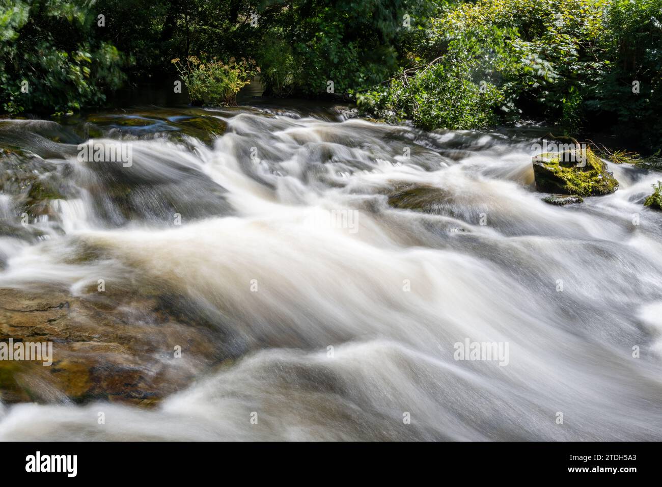 Long exposure of a waterfall on the East Lyn river flowing through the ...