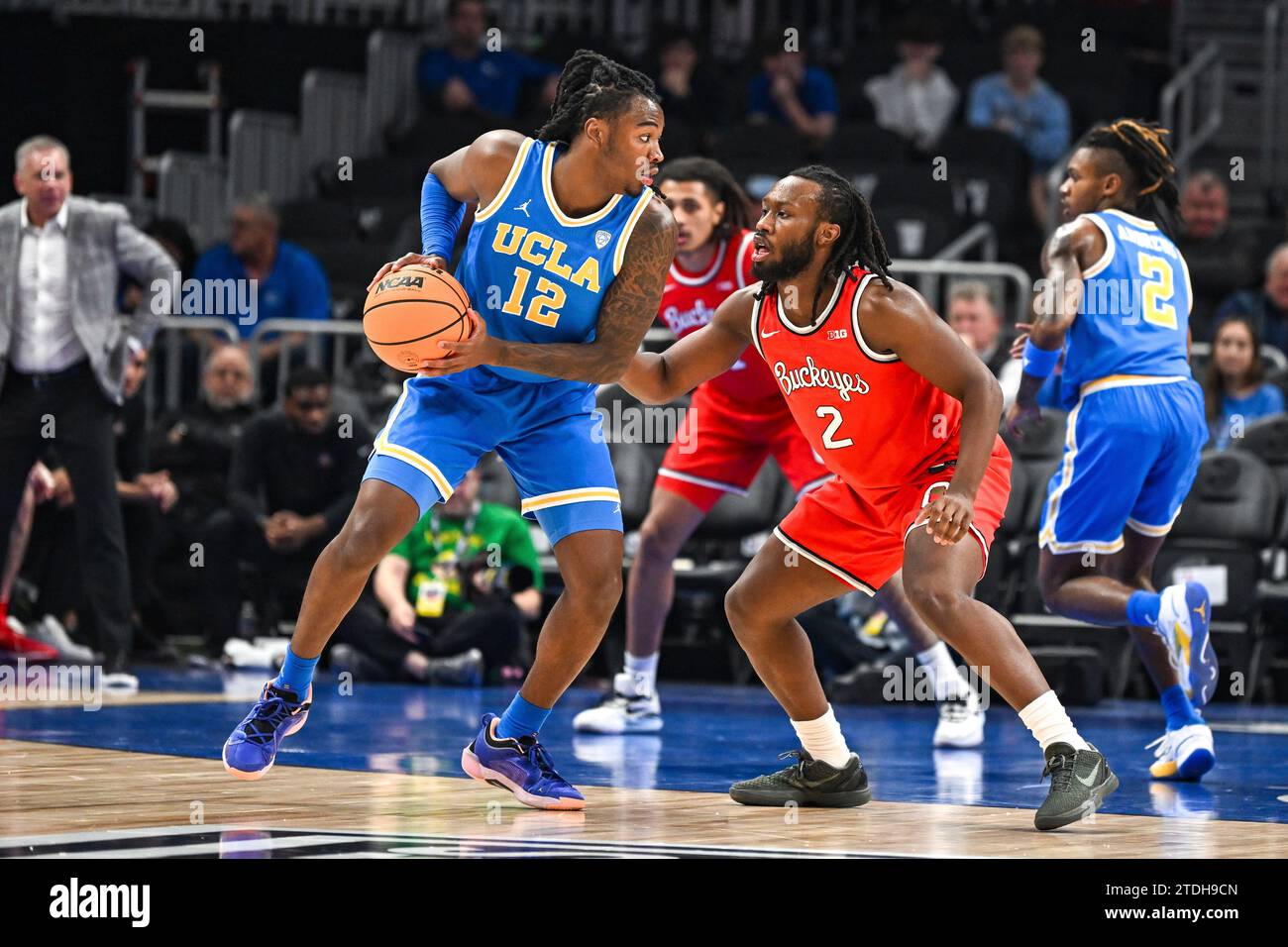 ATLANTA, GA – DECEMBER 16: UCLA guard Sebastian Mack (12) is guarded by ...