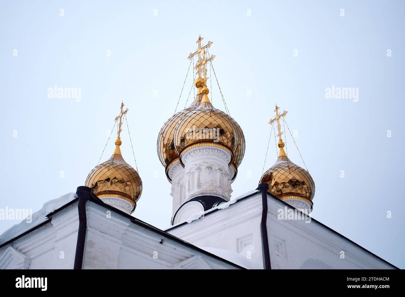 Orthodox church with gilded domes against the sky. Domes with crosses ...