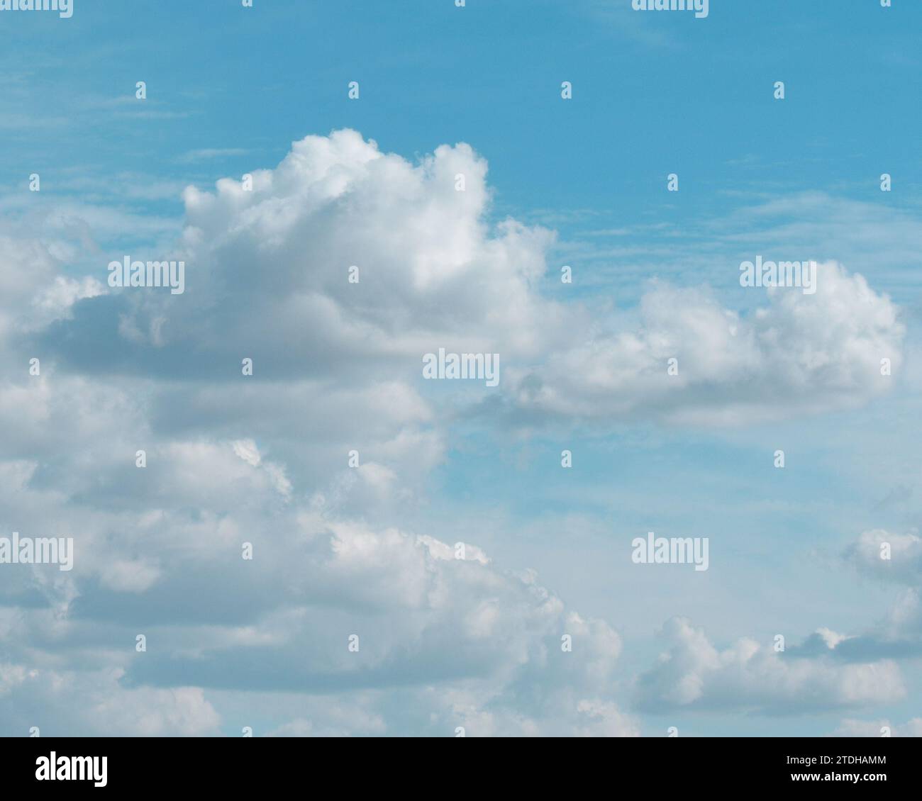 Bluish sky with large puffy clouds Stock Photo - Alamy