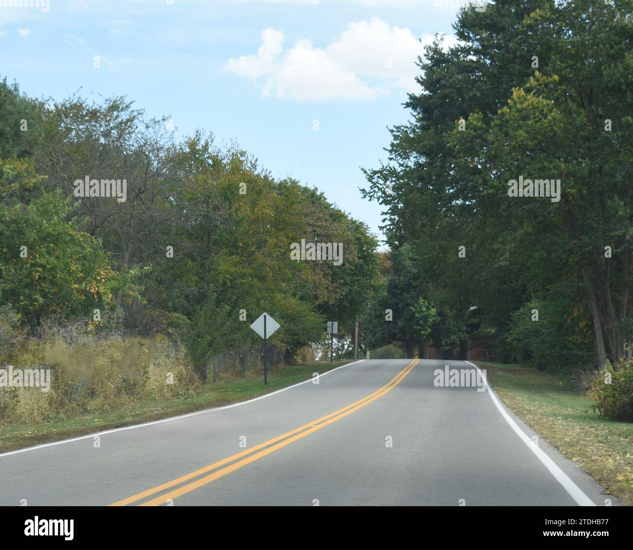 Image of a rural road with road signs Stock Photo - Alamy