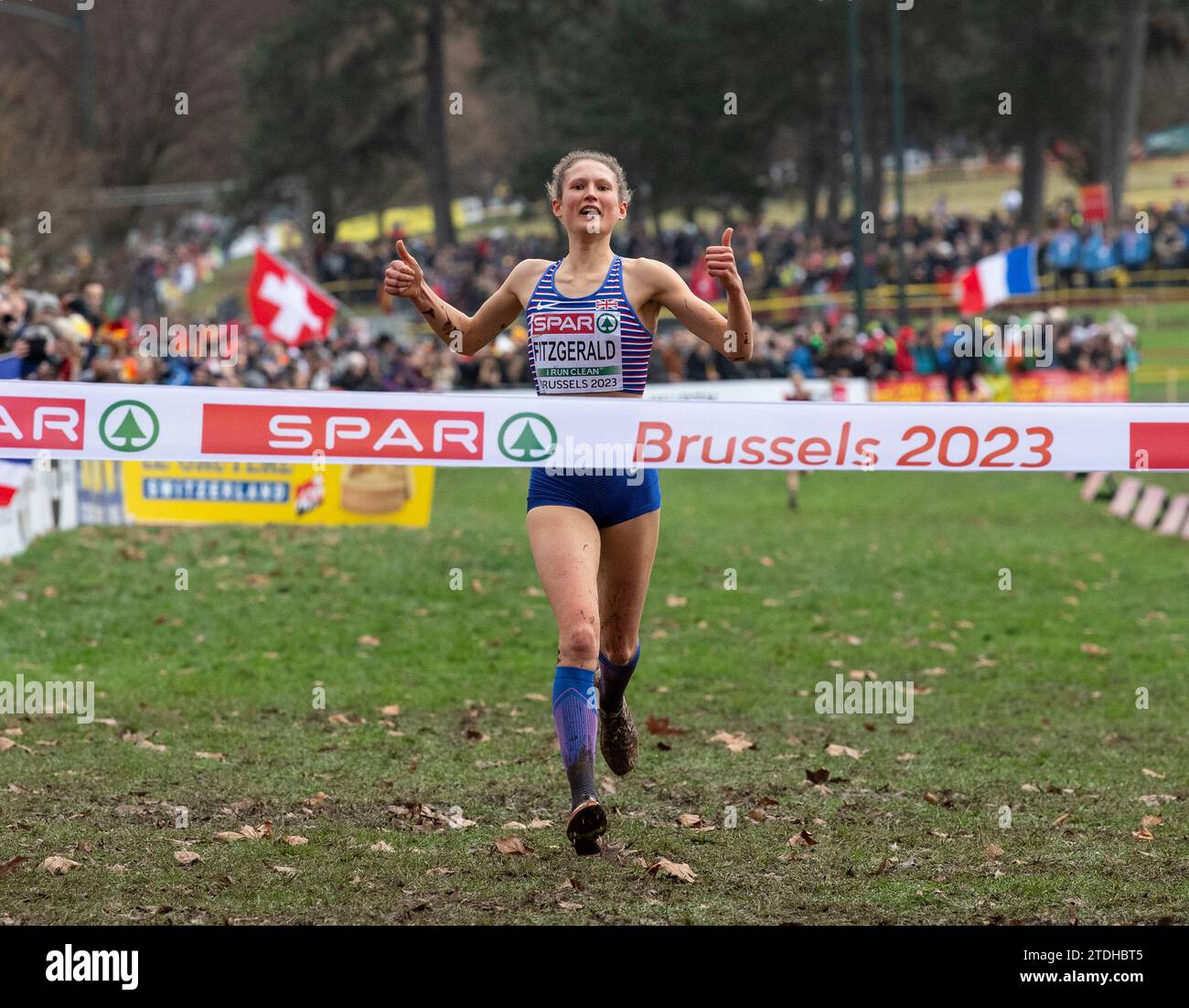 Female athlete crossing finish line hi-res stock photography and images ...