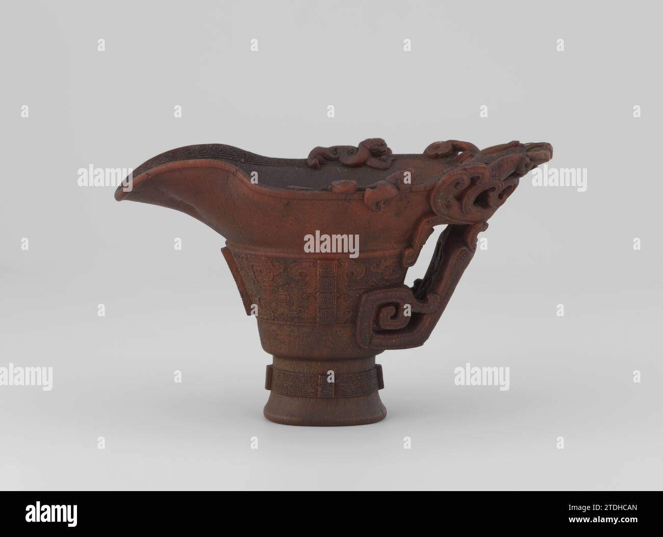 Carved rinor horn cup imitating bronze object with decorations of ...