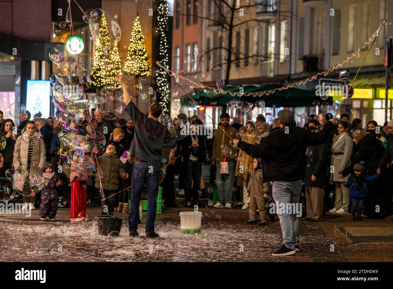Pre-Christmas time, street artists, creating big soap bubbles, at ...
