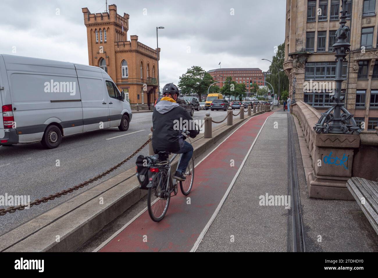 Cyclists on the red banded cycle lane on a footpath in Hamburg, Germany ...