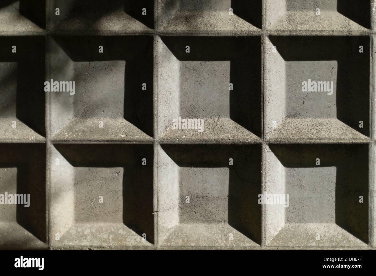 Concrete fence. A Structure of Squares. Fence in the sunlight. Concrete ...