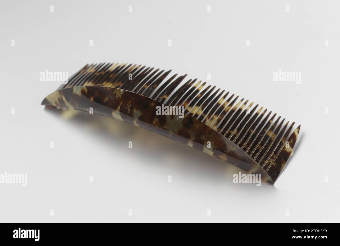Hair comb of imitation turtle with an unadorned round back that stands ...