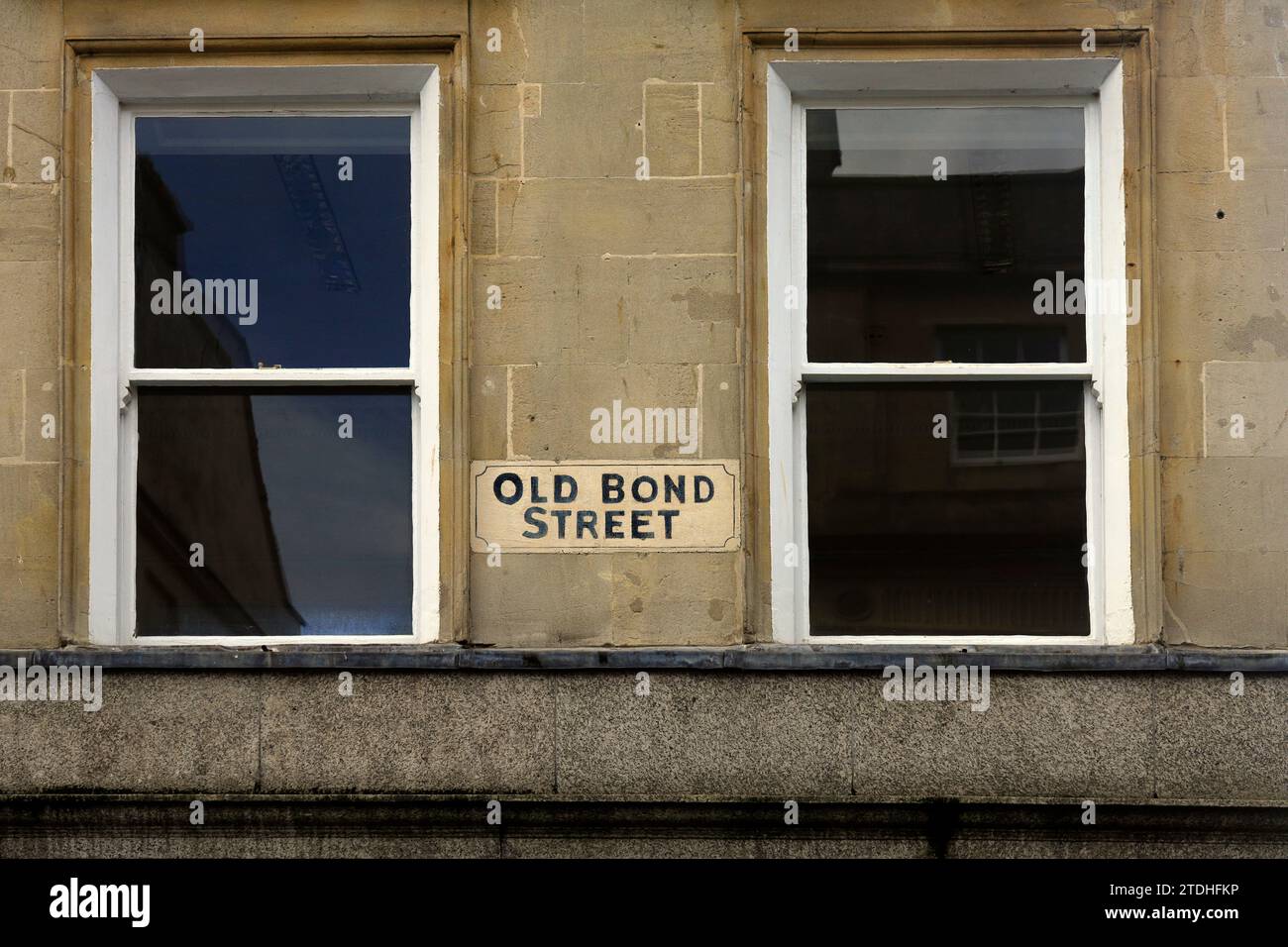 Old Bond Street sign on the side of a building between two windows ...