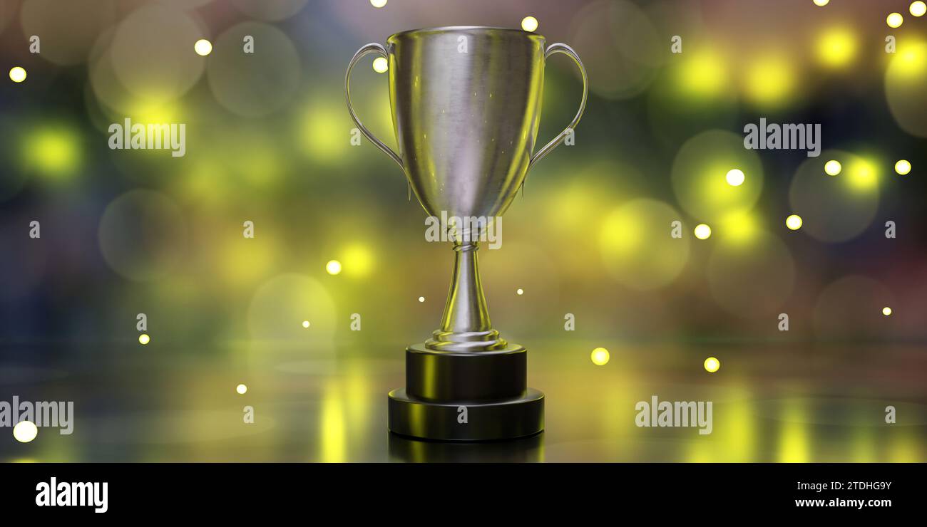 Silver steel trophy cup with dual handle on bokeh light background. A ...