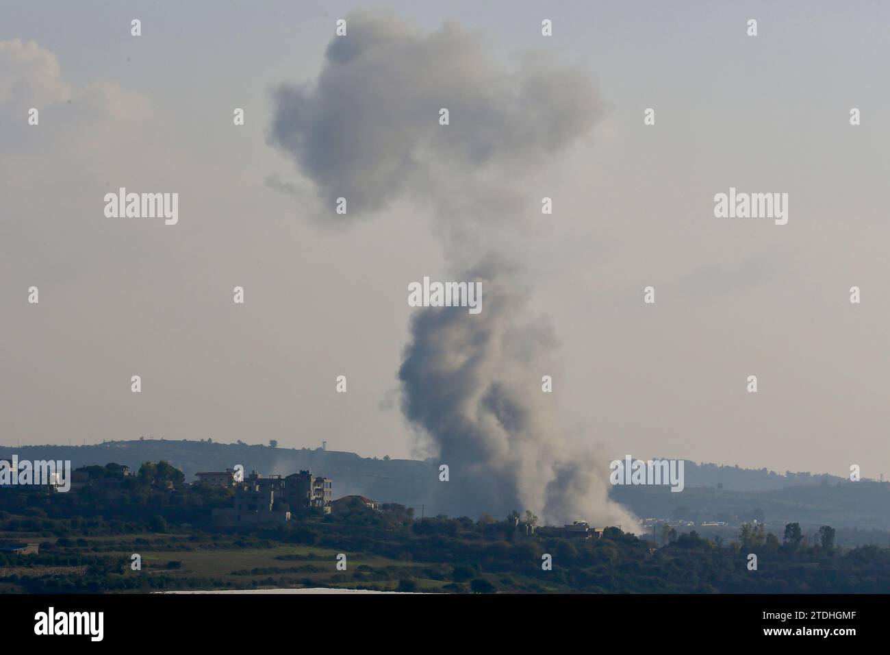 Tayr Harfa, Lebanon. 18th Dec, 2023. Smoke rises following an Israeli ...
