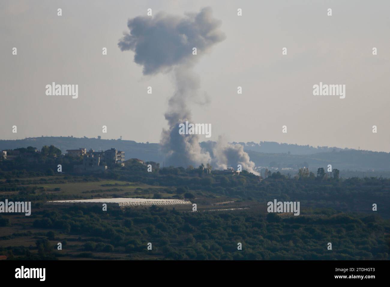 Tayr Harfa, Lebanon. 18th Dec, 2023. Smoke rises following an Israeli ...