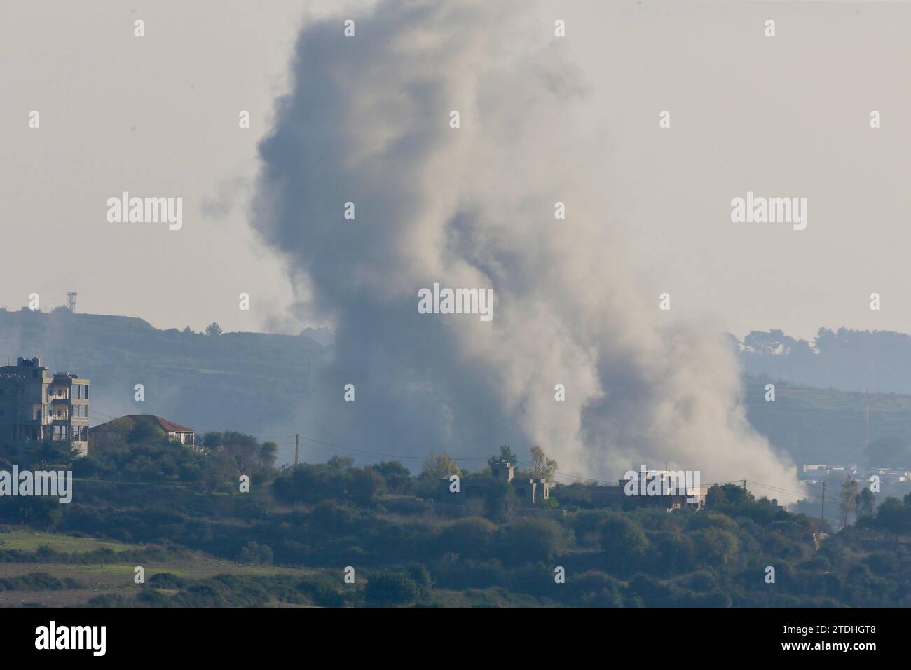 Tayr Harfa, Lebanon. 18th Dec, 2023. Smoke rises following an Israeli ...