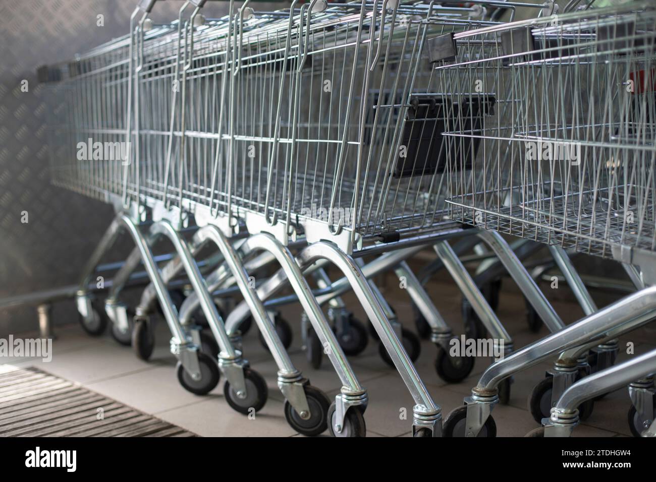 Shopping carts. Inside store. Steel trolleys. Shopping Stock Photo - Alamy