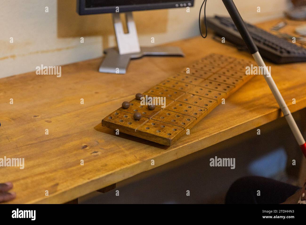 Close-up of the number writing tool by blind people: wooden tablet and ...