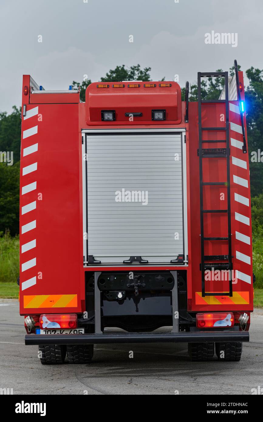 In this captivating scene, a state-of-the-art firetruck, equipped with ...