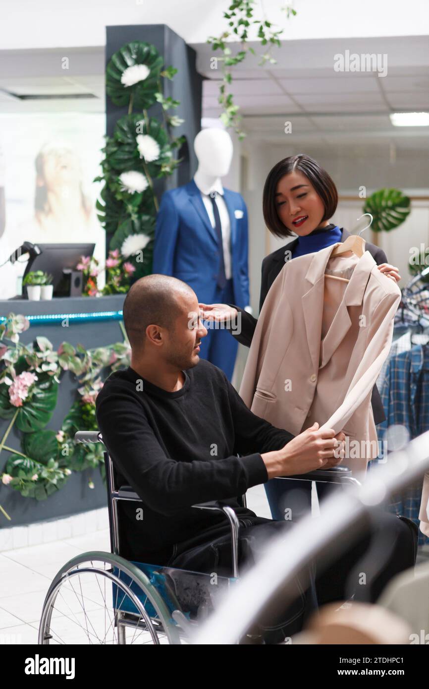 Seller helping client in choice hi-res stock photography and images - Alamy