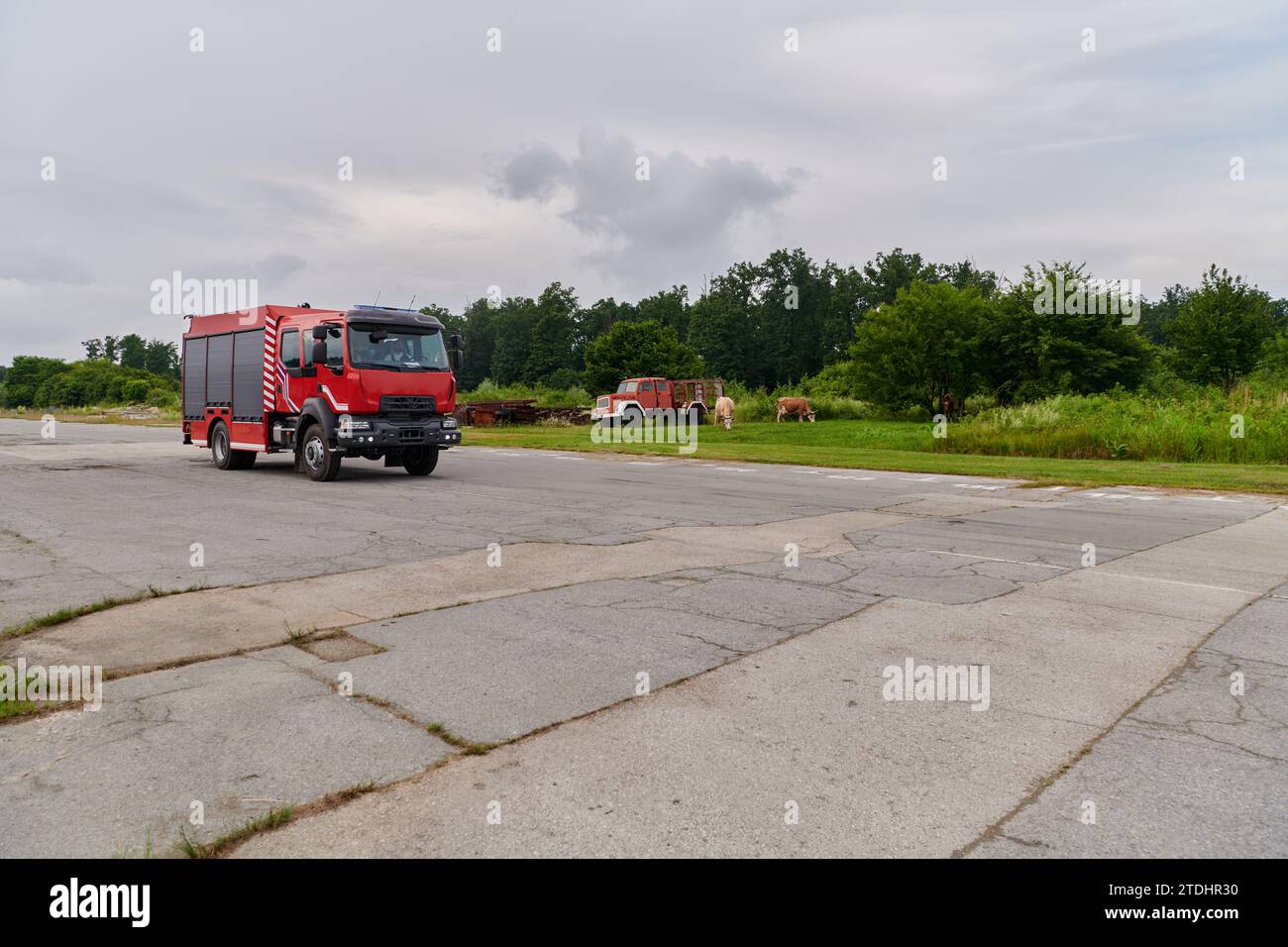 In this captivating scene, a state-of-the-art firetruck, equipped with ...