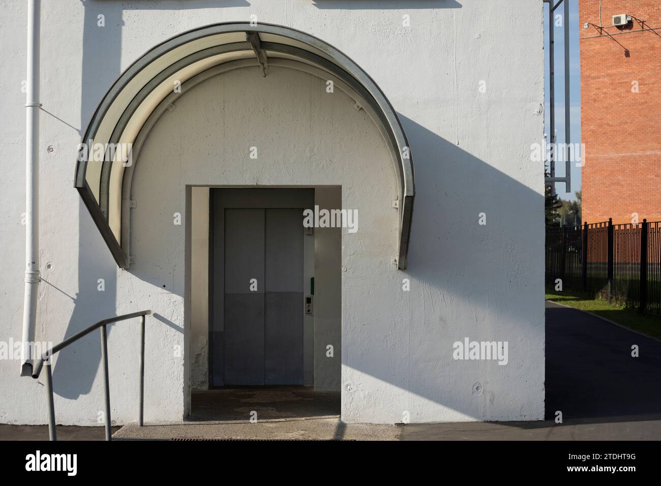 The entrance to the building. Technical entrance. Canopy on the ...