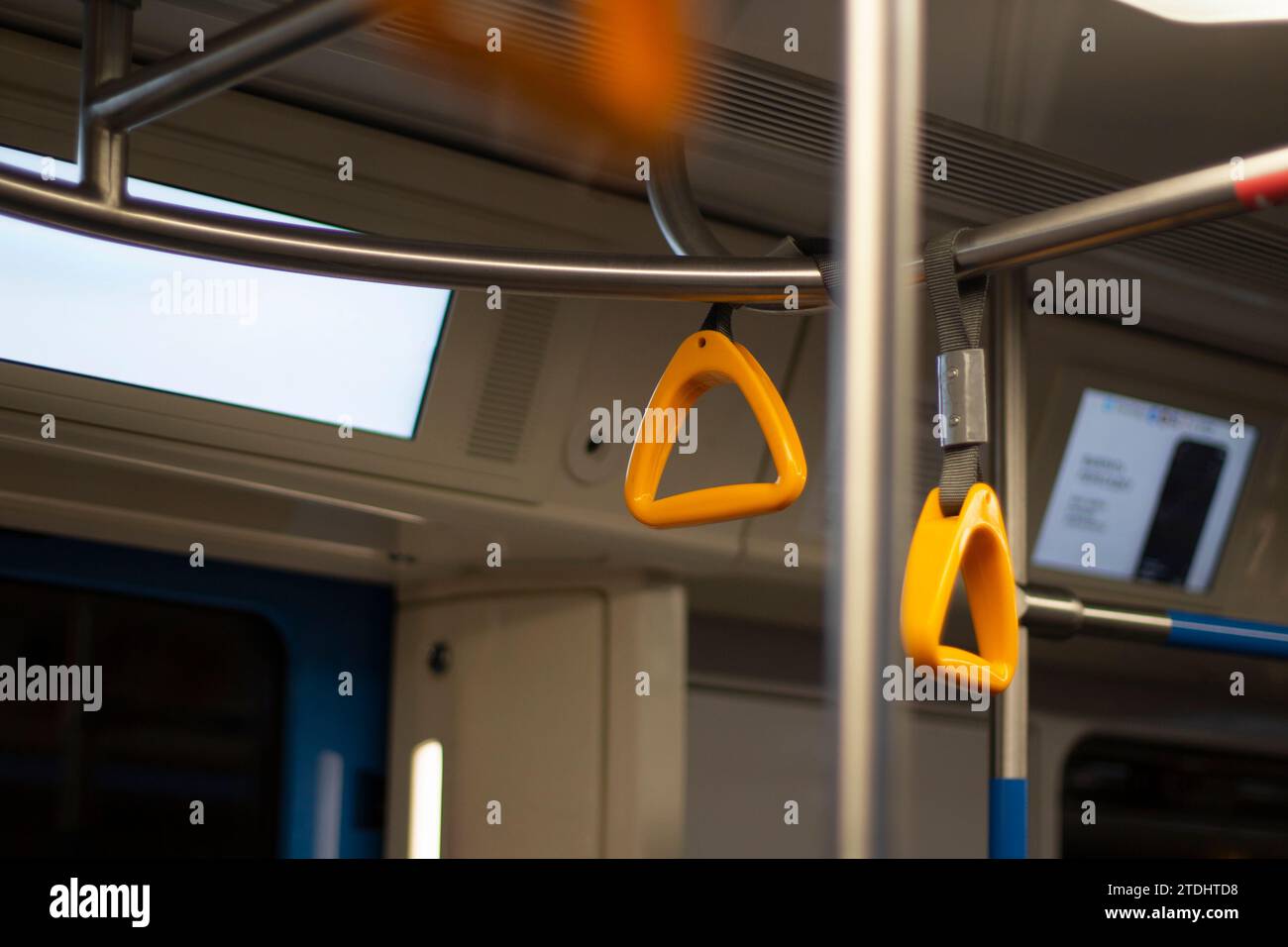 Handrail in the bus. Yellow hand handle. Passenger holder. The interior ...