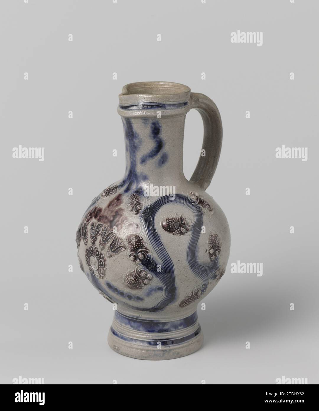 Jug with floral scrolls, anonymous, c. 1680 - c. 1740 Can of stoneware on a high base with a ...