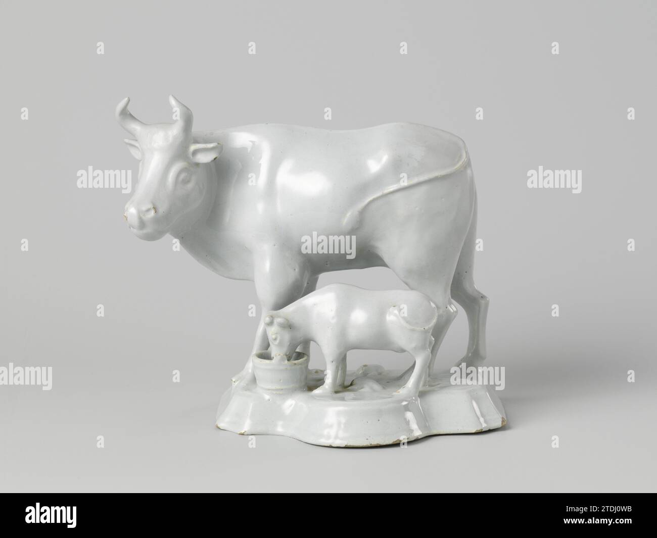 Cow and calf with tobbe and pedestal with leaf work and frogs in relief ...