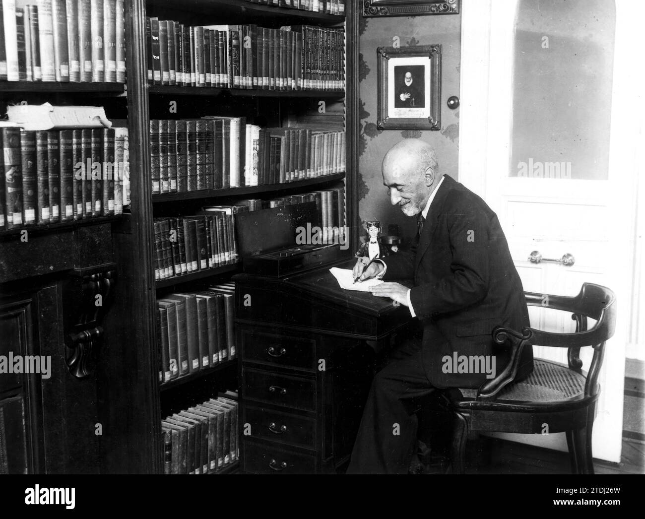 1930 (CA.) Mr. Jacinto Benavente writing in the library of his home ...